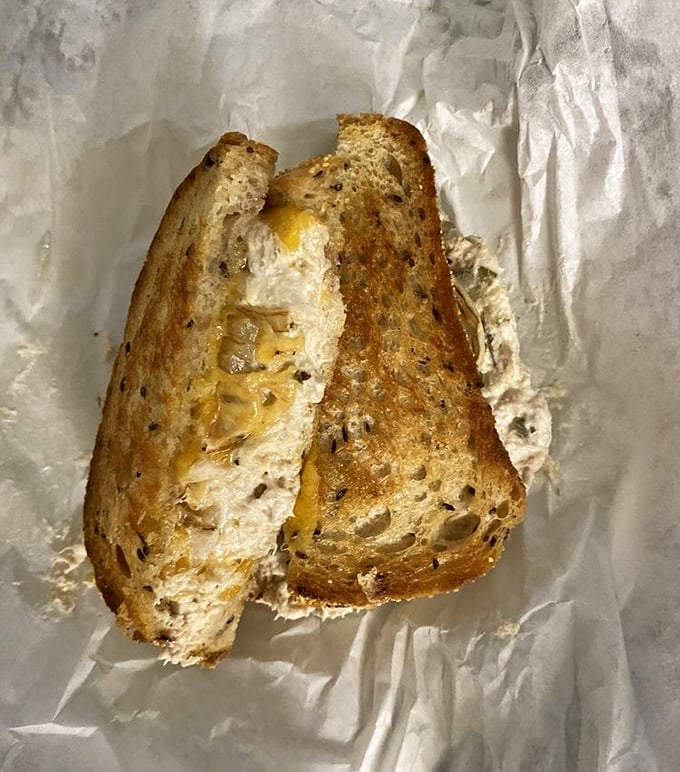 The grilled cheese reveals itself like a melty treasure chest – perfectly toasted bread giving way to a gooey interior that would make any comfort food lover weak in the knees.