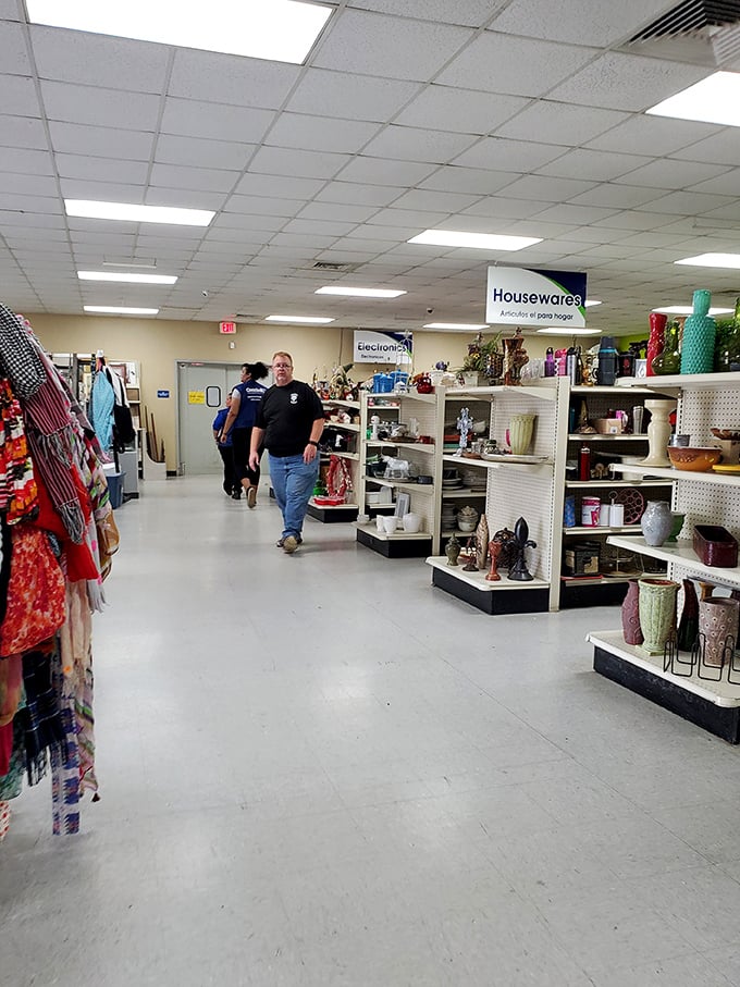 The housewares aisle: where shoppers navigate a sea of possibilities, each turn revealing someone else's former kitchen companions.