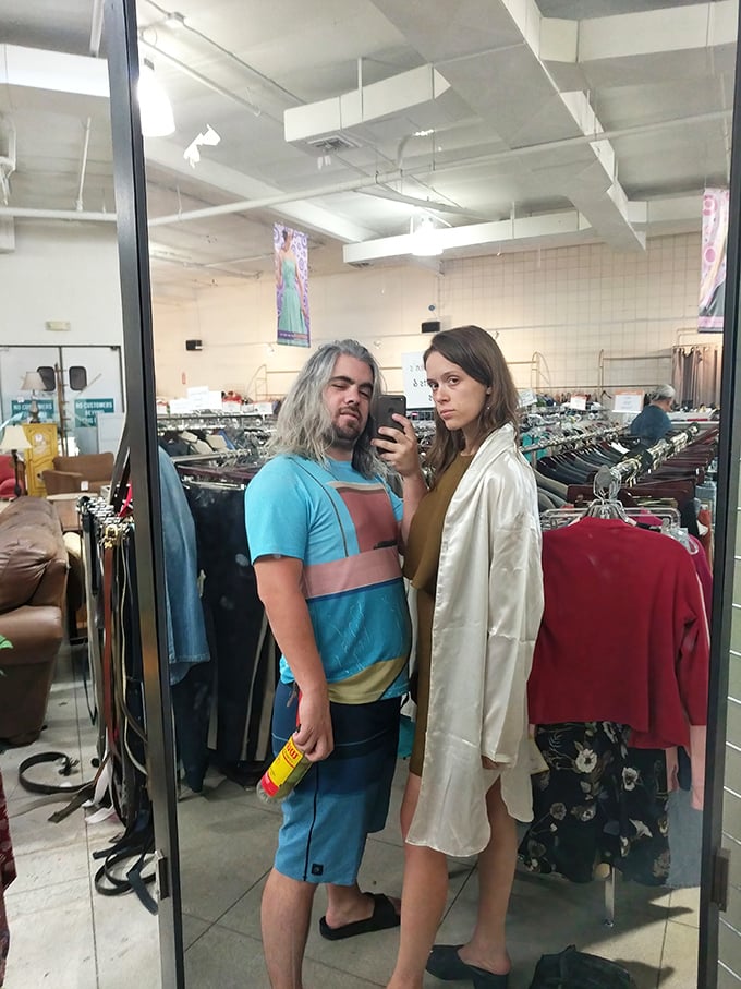 The image shows shoppers browsing through clothing racks in the store's well-organized interior.