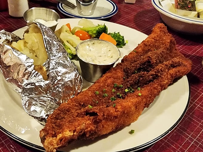That walleye dinner isn't messing around—crispy, generous, and served with a baked potato wrapped in foil like a delicious present.