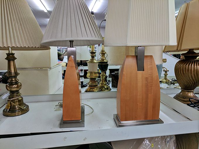 Lamp lineup that spans decades of design evolution. That brass beauty on the left probably illuminated someone's 1970s shag-carpeted living room.