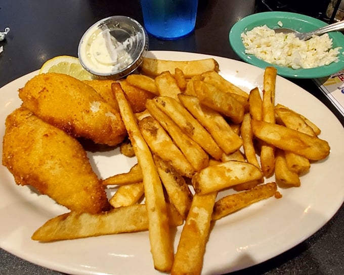 Yellow perch, the walleye's smaller cousin, gets the royal treatment here—fried to golden perfection and served with fries that could start their own fan club.