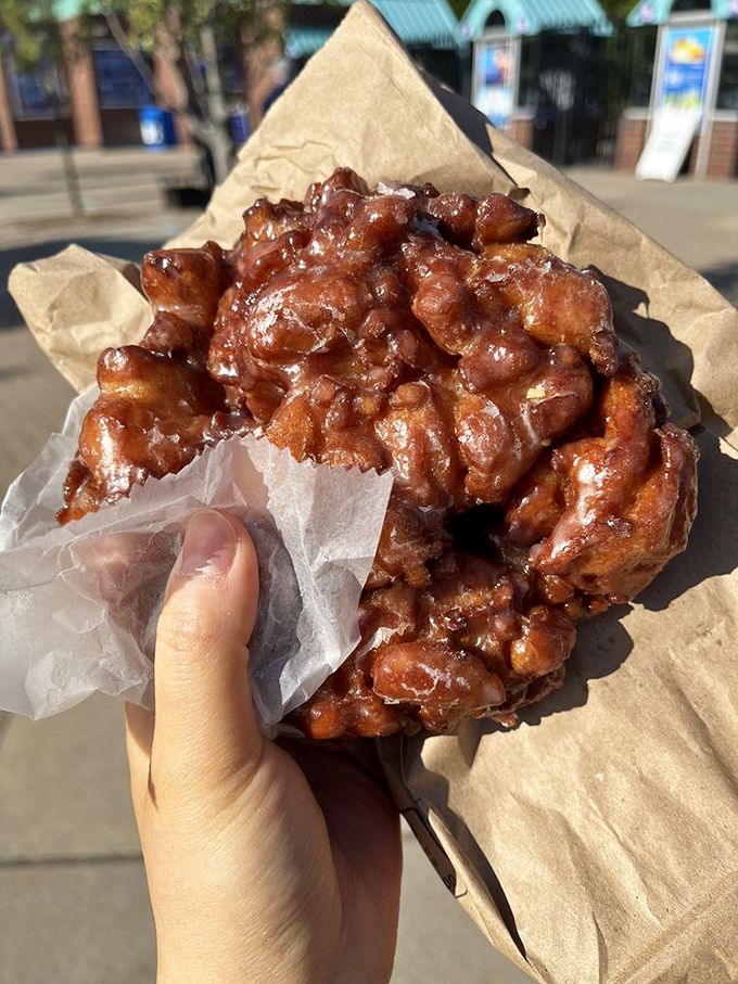 Not so much a fritter as a monument to fried apple glory. Crispy edges giving way to tender, cinnamon-laced interior—architectural genius.