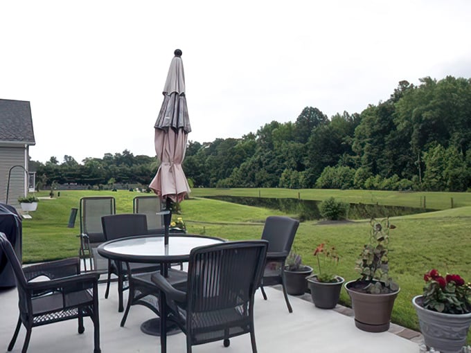 Outdoor living spaces that blur the line between home and nature—where patio furniture becomes the stage for impromptu happy hours and sunset appreciation.
