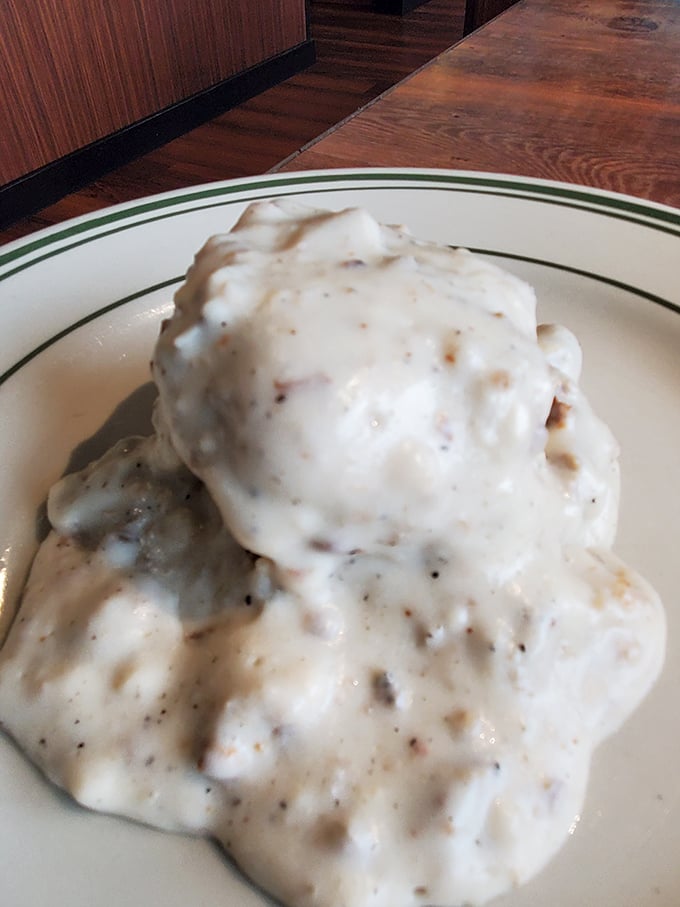 Biscuits drowning in creamy country gravy—the breakfast equivalent of being wrapped in your grandmother's warmest quilt on a rainy morning.