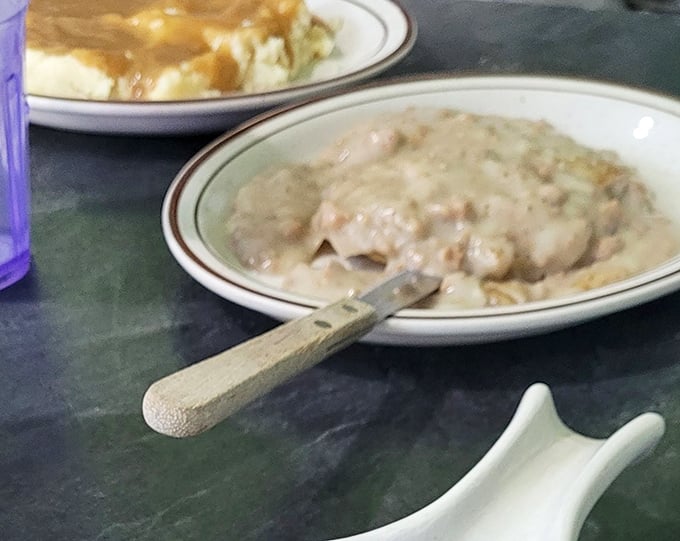 The holy grail of comfort food—biscuits and gravy that would make your grandmother both proud and slightly jealous.