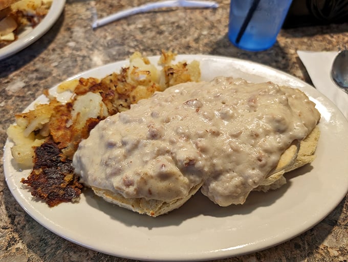 Biscuits smothered in sausage gravy—the kind of breakfast that makes you want to hug the cook and take a nap simultaneously.