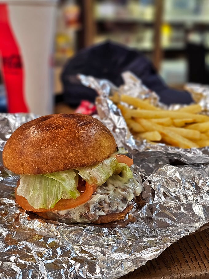 This isn't just a burger—it's edible architecture with the perfect ratio of meat to toppings. The foil wrapper doubles as a treasure map.