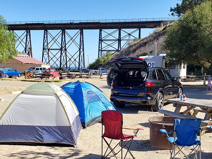 Camping with a view that beats any five-star hotel. The trestle frames your morning coffee spot like industrial-chic décor for Mother Nature.