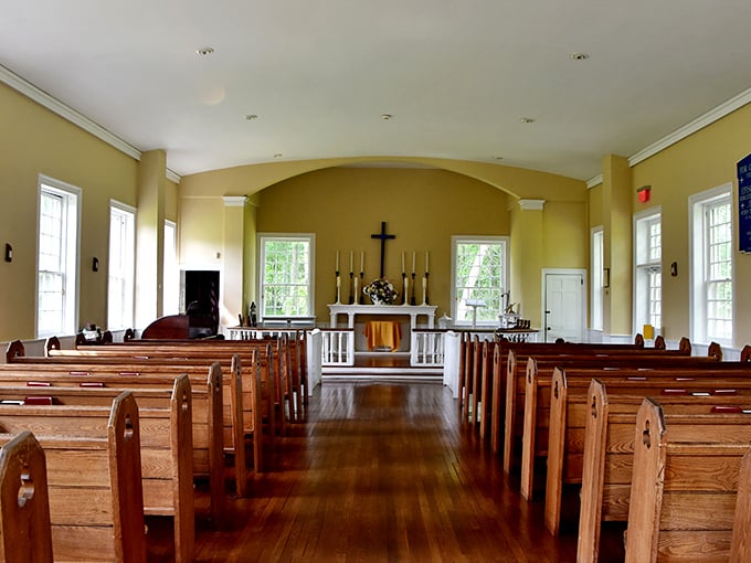 The historic chapel's simple elegance speaks volumes. Wooden pews bathed in natural light—spiritual experiences don't need special effects.