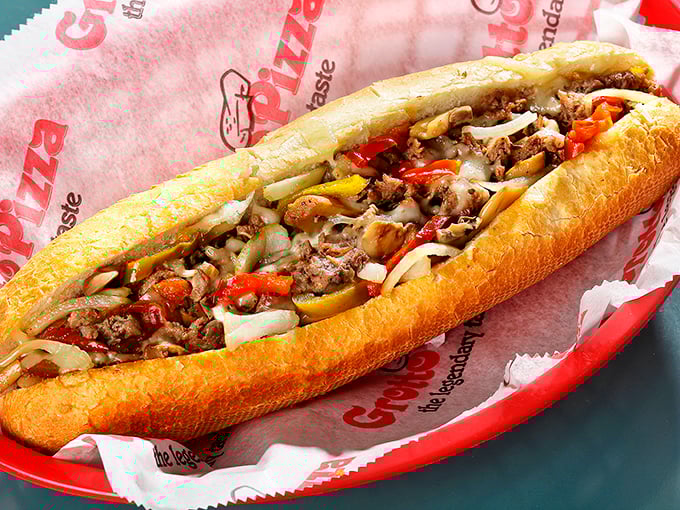 Behold the cheesesteak in all its glory—a perfect harmony of meat, cheese, peppers, and onions cradled in a roll that deserves its own fan club.
