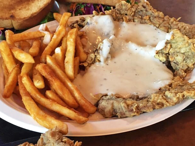 The holy grail of Texas cuisine – a chicken fried steak that's practically bursting off the plate, smothered in gravy that should be illegal in at least seven states.