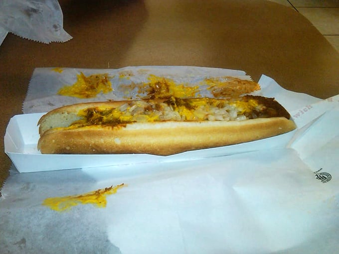 The humble hot dog, elevated to art form. Nestled in a soft bun and smothered with chili and cheese—proof that simplicity can be spectacular.