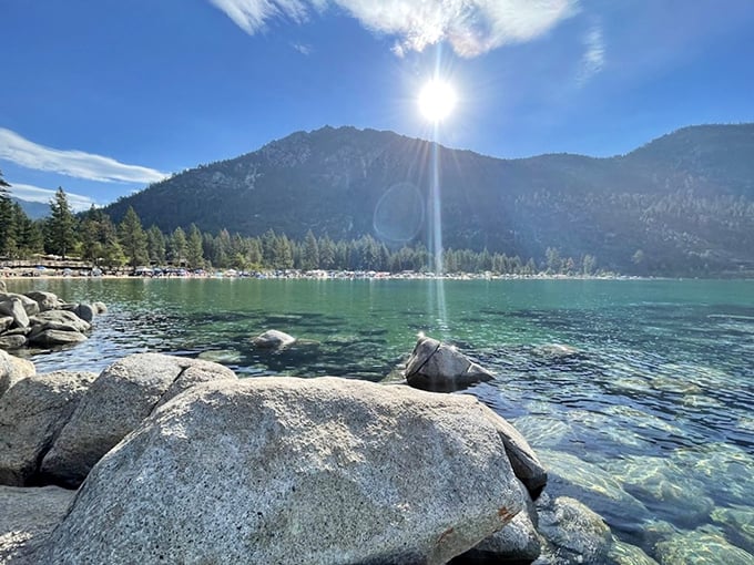 Sunlight dancing across crystal waters. Those granite boulders have front-row seats to nature's greatest show—no tickets required.