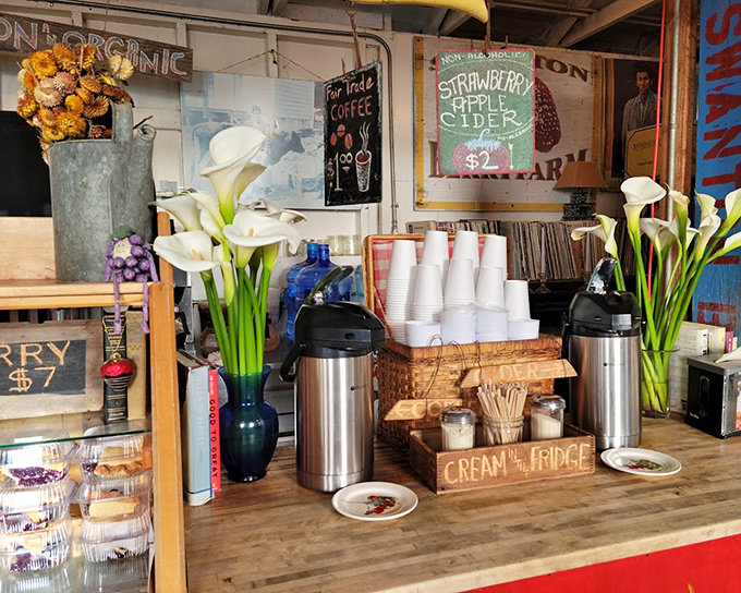 Coffee, cider, and flowers—the farmstand trifecta that turns a simple berry stop into an afternoon's delightful detour from the digital world.