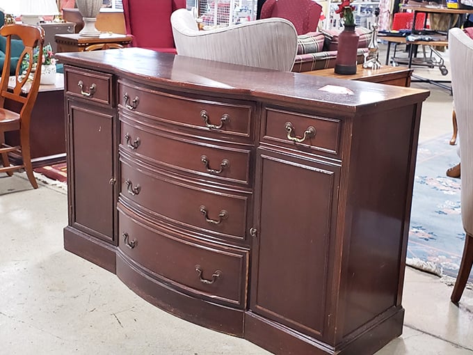 This stately mahogany sideboard isn't just furniture—it's a time machine to Sunday dinners at grandma's house, with plenty of storage for your own family memories.