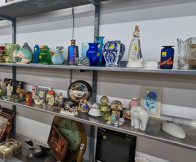This shelf of decorative knickknacks tells a thousand stories—each vase and figurine once graced someone else's mantelpiece.