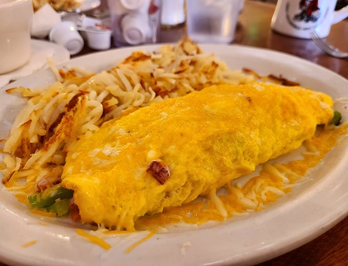 This Denver omelet doesn't just contain peppers and ham—it celebrates them in a fluffy yellow embrace that would make Colorado proud.
