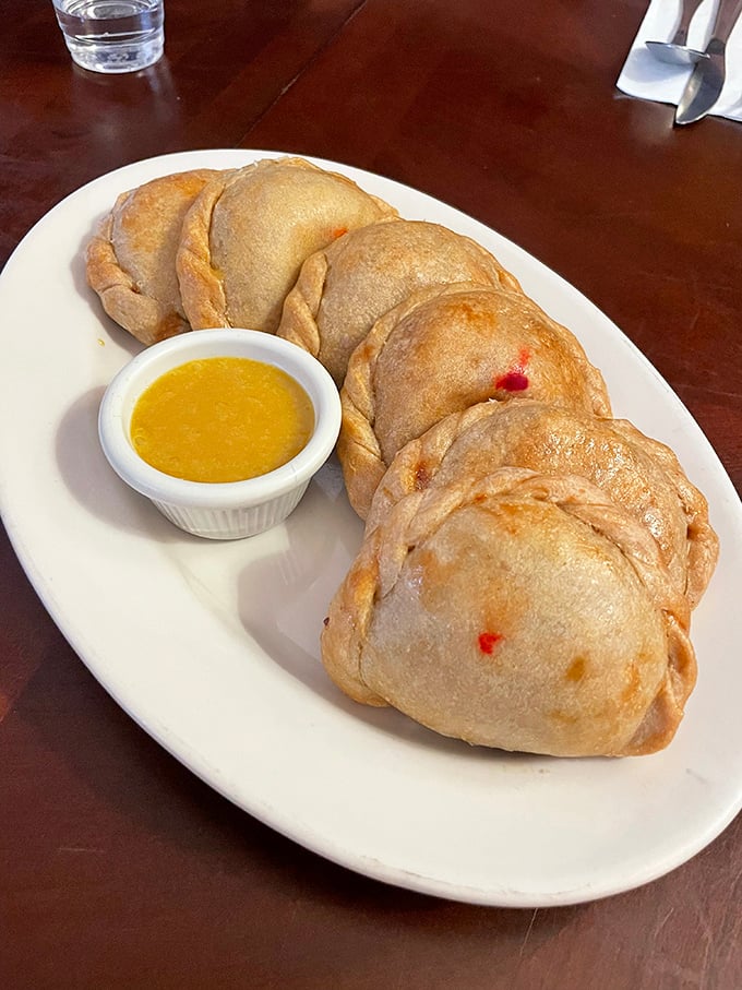 These empanadas aren't just pockets of goodness—they're edible treasure chests. The golden-brown exterior practically whispers "bite me" in the most family-friendly way possible.