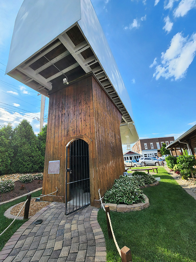 The entrance beckons visitors through a wooden archway that supports this colossal correspondence container. Your letters have never felt so inadequate.