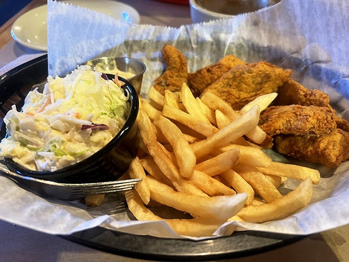 Golden-fried perfection with crispy fries and creamy coleslaw – proof that sometimes the simplest pleasures are the most profound. Comfort food that speaks fluent happiness.