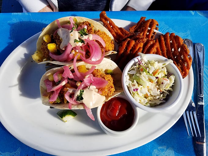 These fish tacos aren't just topped with pickled onions—they're crowned with them, like royalty of the handheld seafood kingdom.