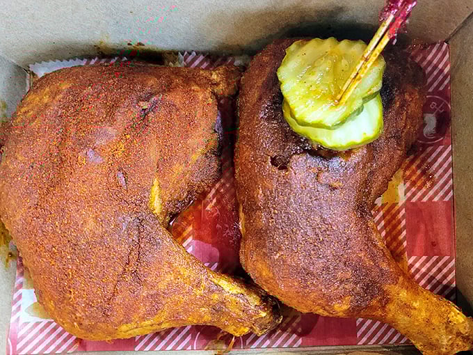 Two pieces of perfectly spiced dark meat chicken with that signature pickle on top—like a crown jewel on edible royalty.