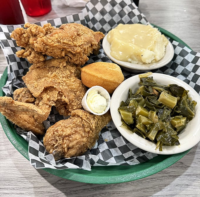 Fried chicken that makes you understand why people willingly cross state lines for a meal. Those sides aren't just accompaniments—they're co-stars.