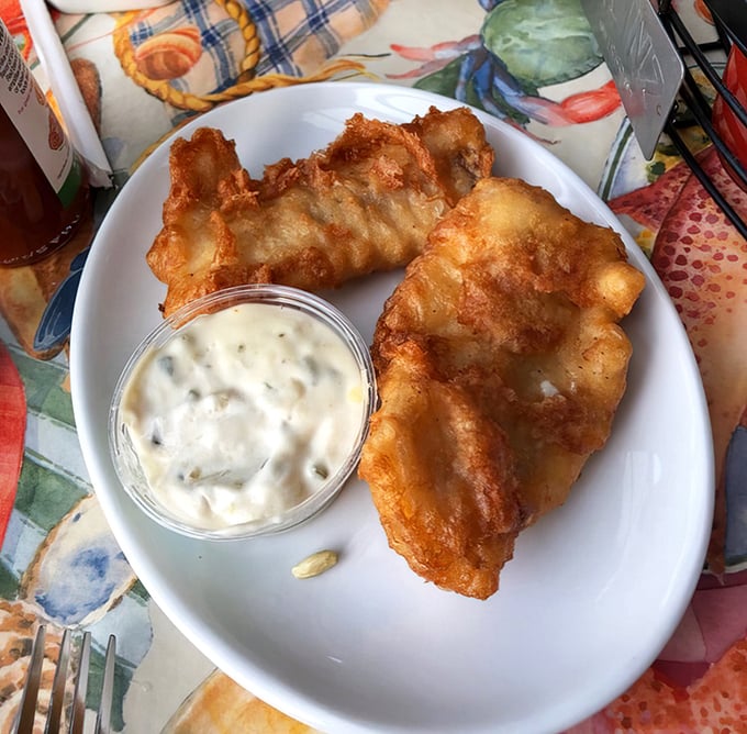 Golden-battered fish that shatters with each bite, paired with house-made tartar sauce. This isn't fast food fish—it's seafood that respects its origins.