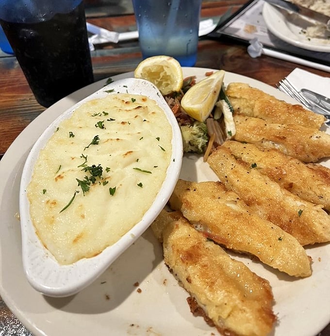 Perfectly golden perch meets its soulmate in creamy garlic mashed potatoes—a Great Lakes romance story that ends happily in your stomach.
