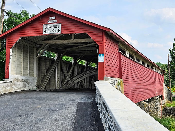 The bridge's classic red exterior pops against green landscapes like it's posing for its close-up, Mr. DeMille.