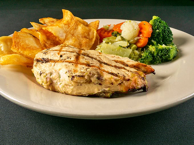 This isn't just grilled chicken—it's the Switzerland of the buffet world, offering a neutral yet delicious option for those taking a brief vacation from red meat.