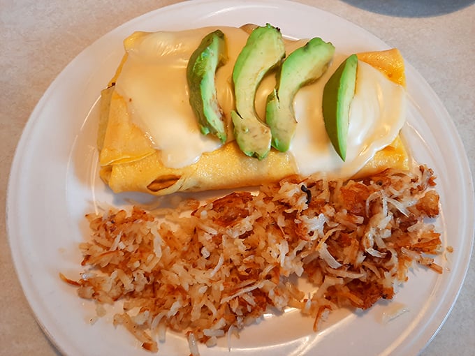 An omelet draped in melty cheese with perfectly crisp hash browns – the breakfast equivalent of hitting all green lights on your morning commute.