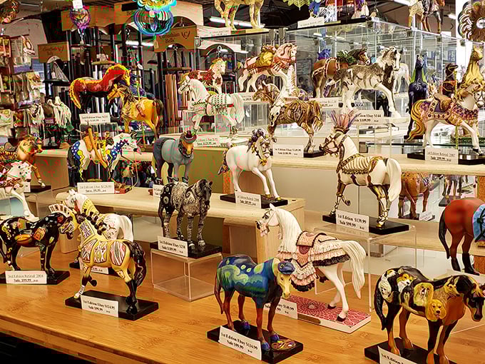 A miniature cavalry of decorative horses stands at attention, each figurine telling its own story through intricate paintwork and whimsical designs.