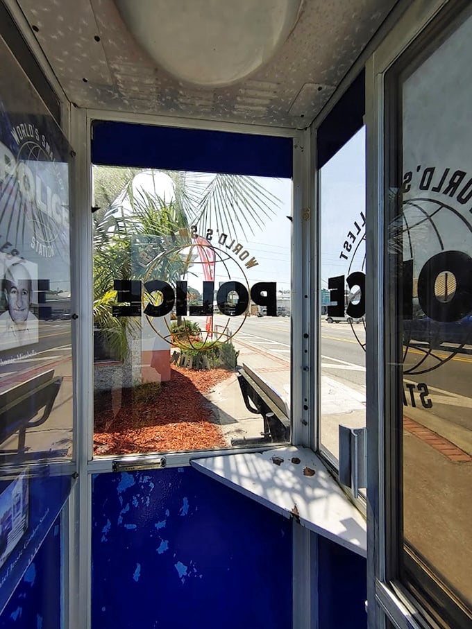 The view from inside reveals the booth's surprising functionality—though writing a ticket might require some creative elbow tucking.
