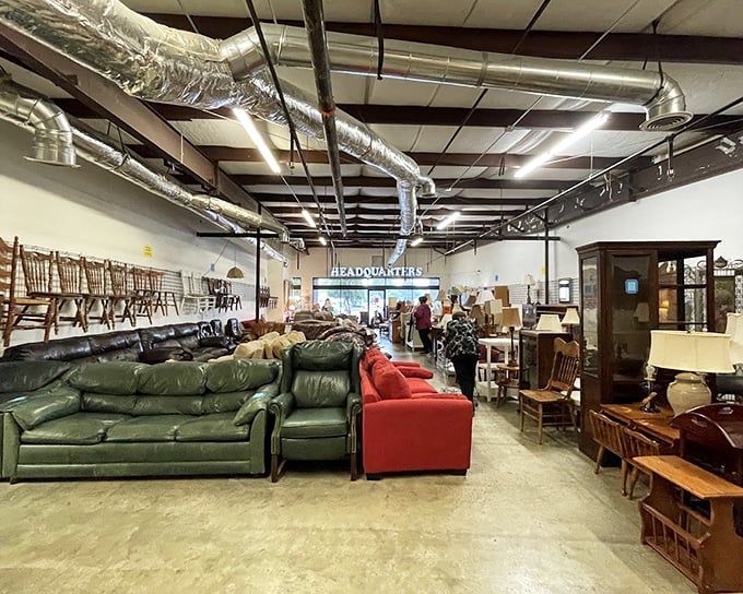 The warehouse section reveals the true scale of this thrifting paradise—where sofas line up like hopeful contestants waiting for their forever homes.