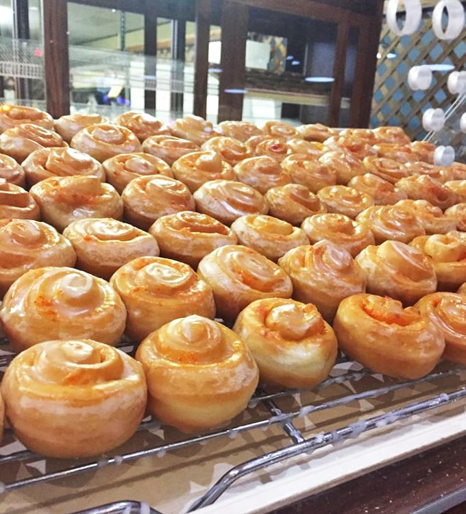 Mini cinnamon rolls fresh from the oven, their glaze still warm and their spiral layers impossibly perfect.