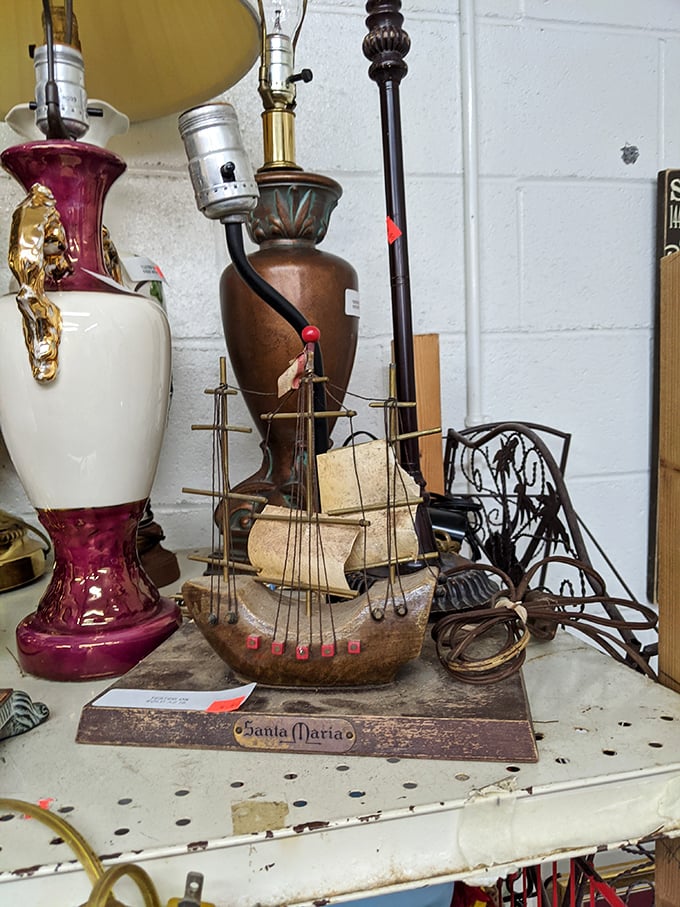 All aboard the Santa Maria! This model ship sails among eclectic treasures, proving that one person's forgotten knickknack becomes another's perfect mantelpiece conversation starter.