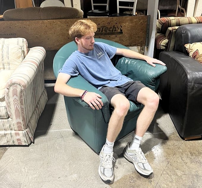 Testing chairs is encouraged here – this young shopper knows comfort shopping when he experiences it firsthand.