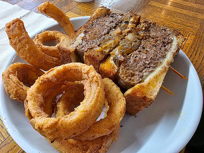 This patty melt and onion ring combo isn't just lunch—it's therapy on a plate. Comfort food that understands you better than your therapist, at a fraction of the cost.