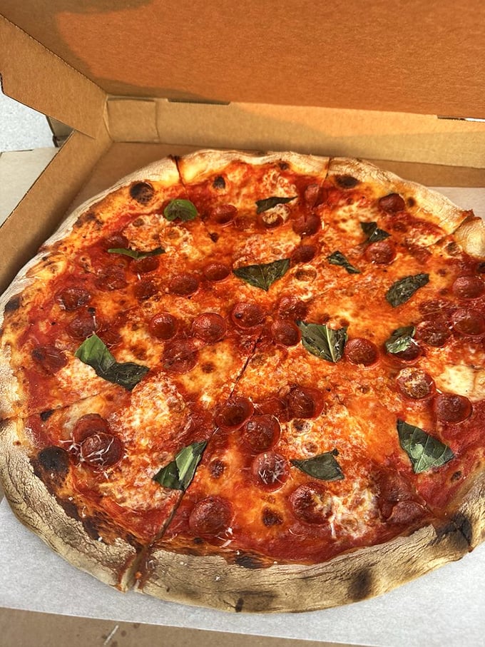 This pepperoni pie doesn't just have toppings—it has personality. Those crispy-edged cups holding little pools of savory magic deserve their own fan club.