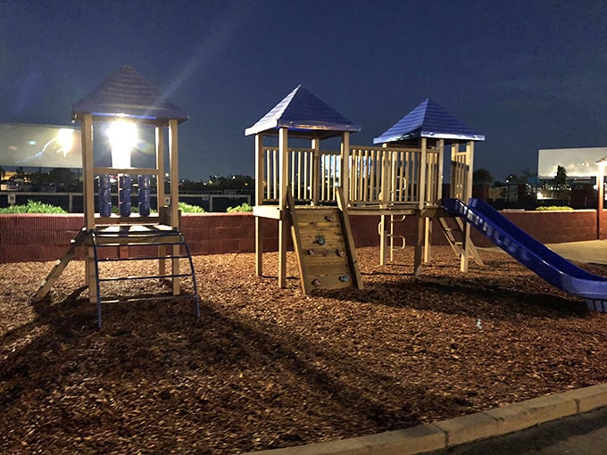 The playground becomes base camp for junior adventurers, where swings and slides compete with coming attractions.