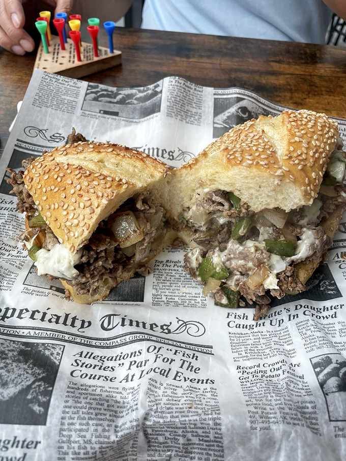 This prime rib sandwich isn't just lunch—it's an event. The newspaper underneath might contain breaking news, but nothing as important as what's on top.