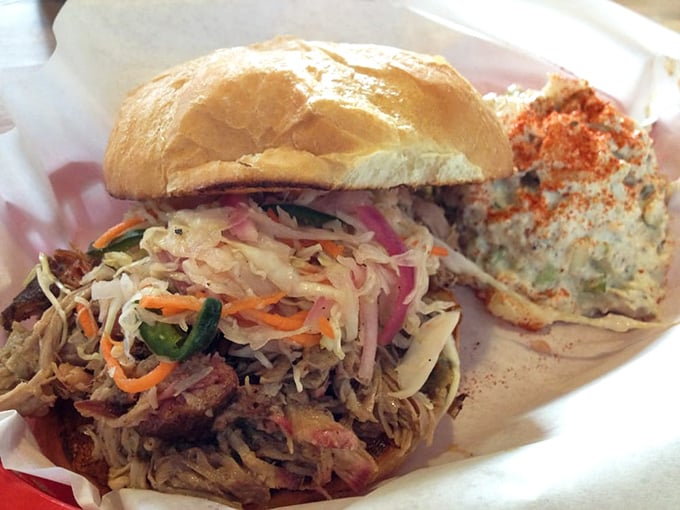 This pulled pork sandwich isn't just a meal – it's an edible love letter from Texas to Oregon, complete with crisp slaw for that perfect textural counterpoint.