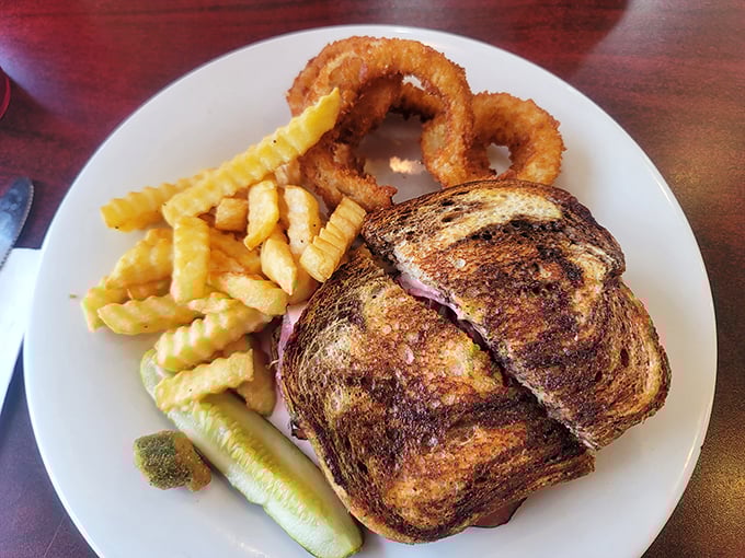 A sandwich so perfectly grilled it deserves its own Florida real estate. Those fries aren't sides—they're supporting actors deserving their own Golden Globe.