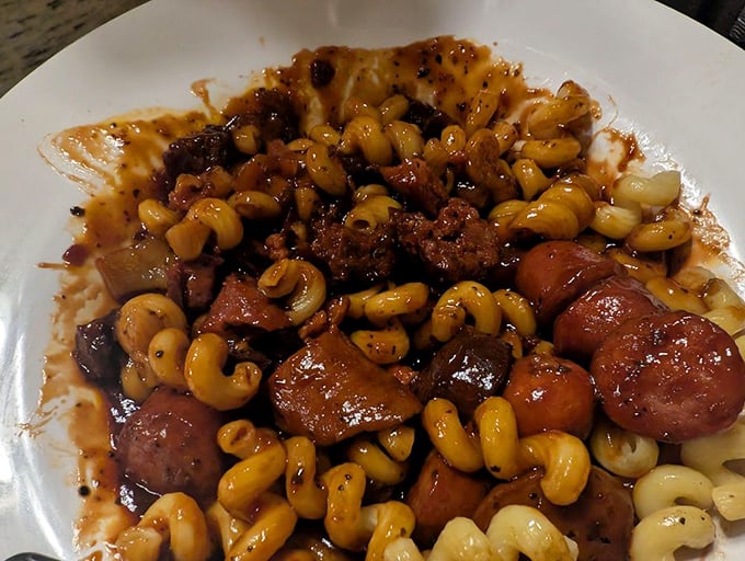 This isn't just pasta with meat – it's a hearty German stew where each elbow macaroni has been personally introduced to savory chunks of sausage in a rich sauce.
