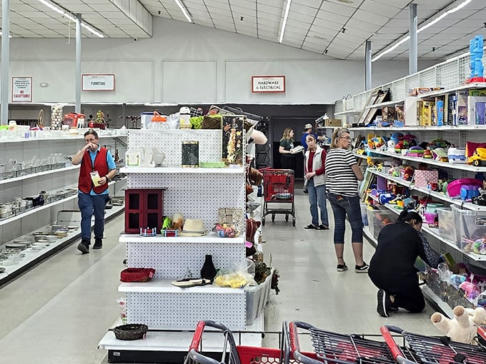 Thrift store anthropology in action—shoppers hunting with the focus of truffle pigs, each on their own quest for buried treasure.