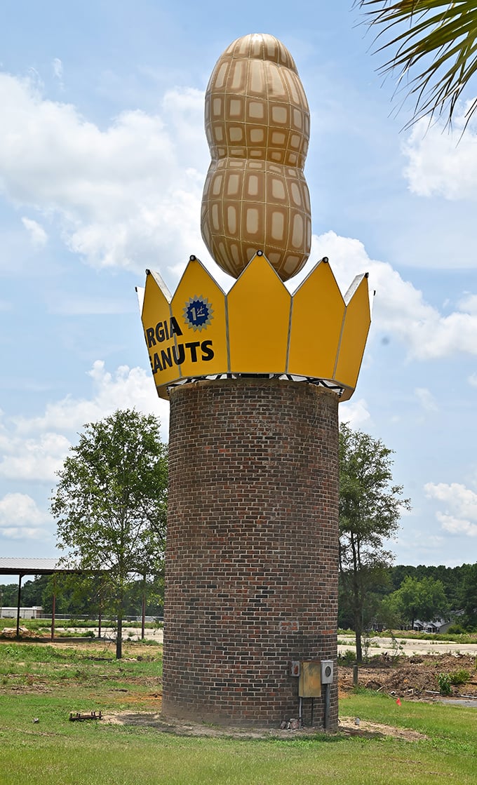 The brick tower provides a sturdy foundation for peanut greatness. Those shrubs aren't just for show—they're the monument's entourage, keeping things classy.