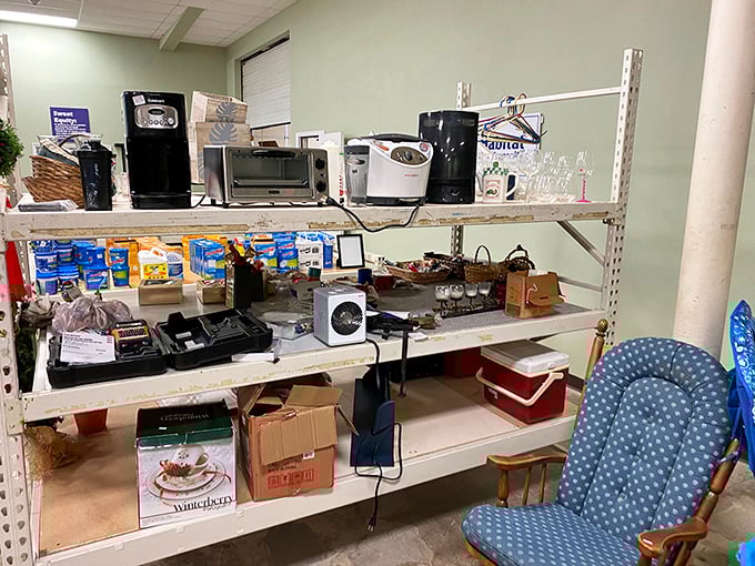 Small appliances with big potential line these industrial shelves. Coffee makers, toasters, and microwaves—all tested and ready for their second act.