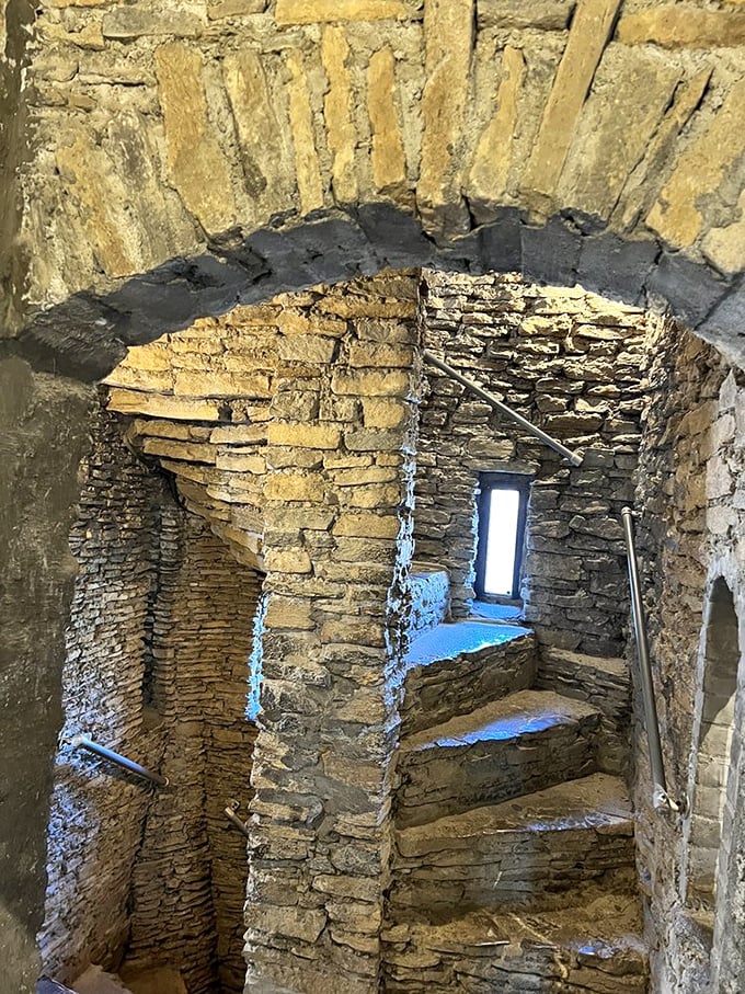These stone spiral stairs weren't designed for modern building codes. The clockwise twist gave defenders the upper hand against right-handed attackers—medieval engineering at its finest.